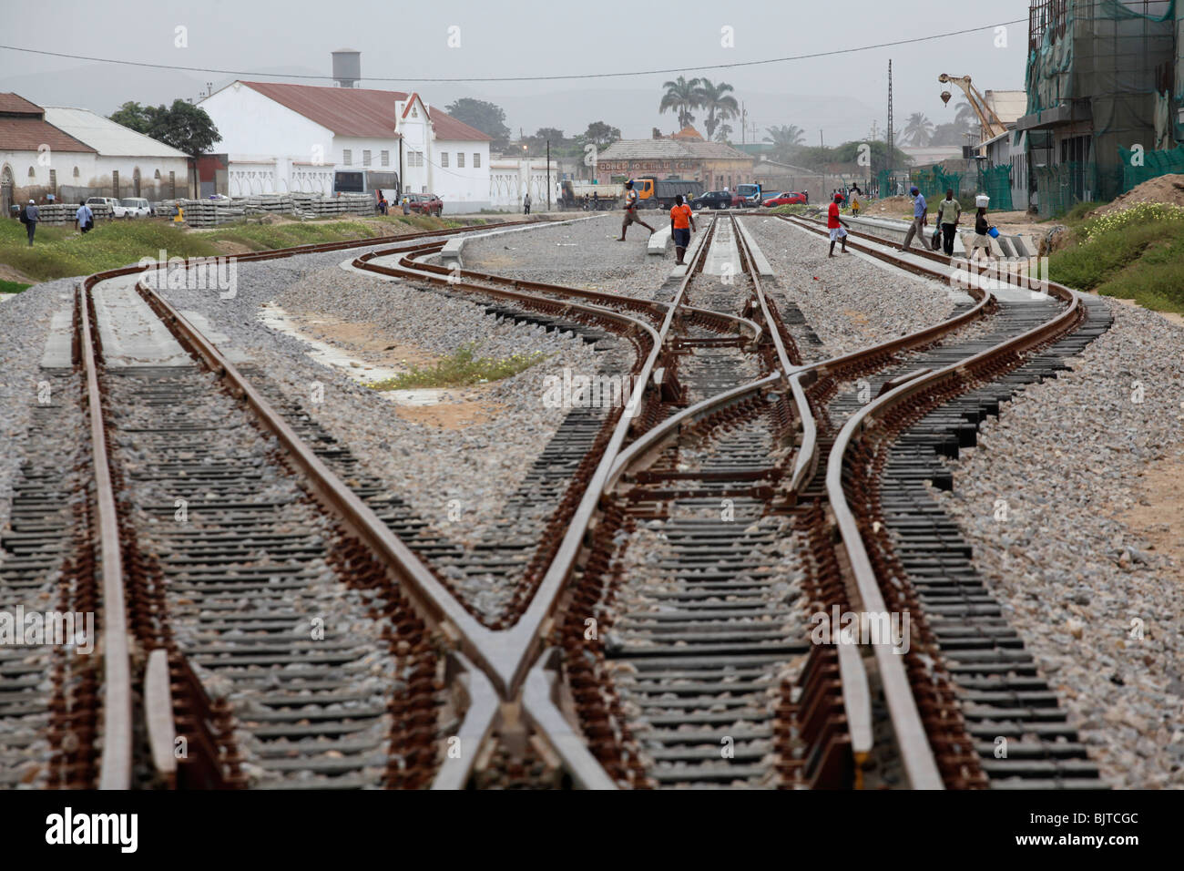 People walk to work across the newly reconstructed Benguela railway ...