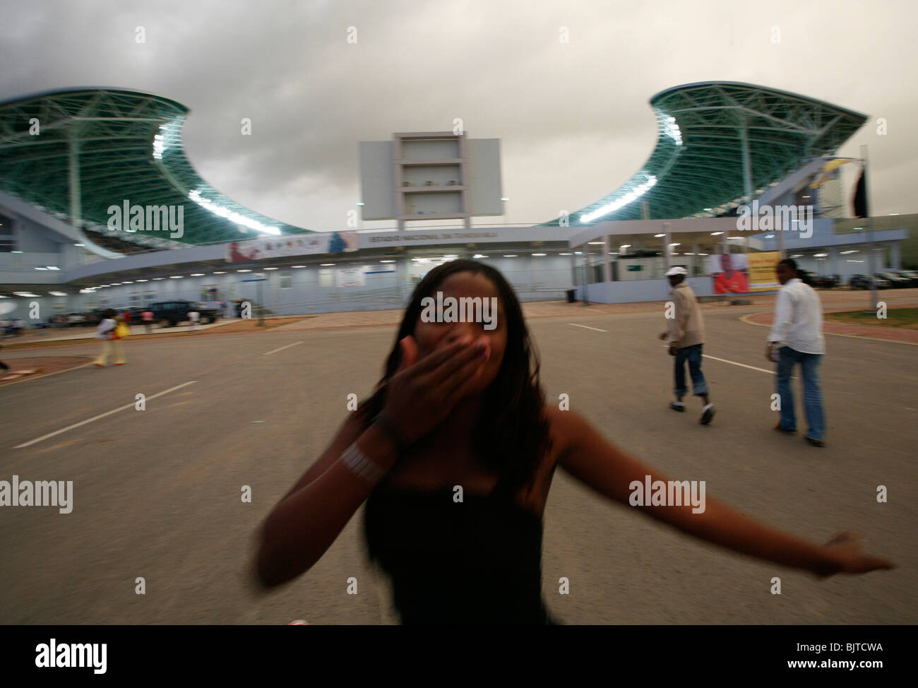 Football fan blowing a kiss at the camera. Lubango Stadium, Angola ...