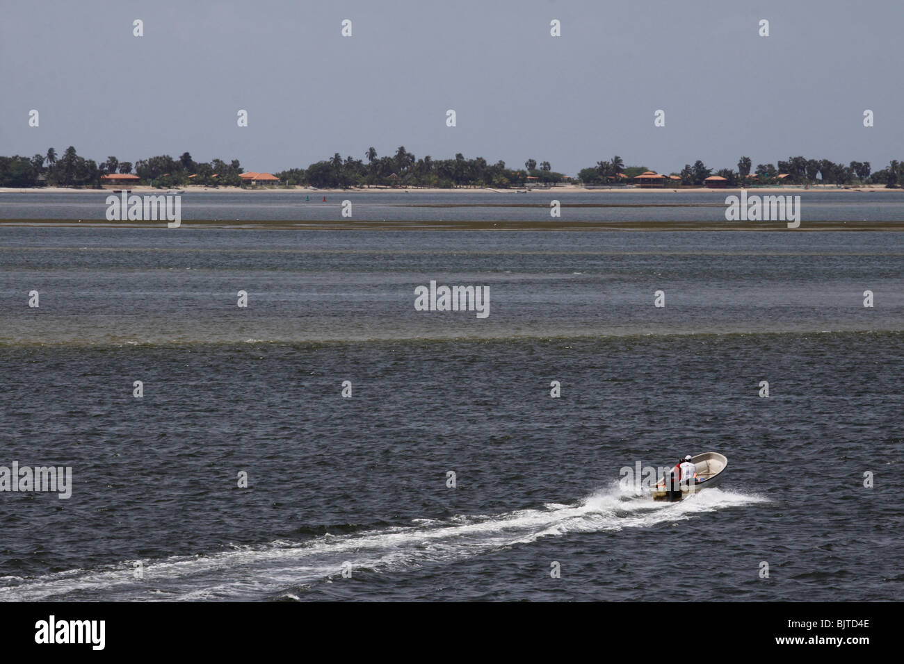 Speedboat travelling across the bay to Mussulo sand spit. Beaches and ...