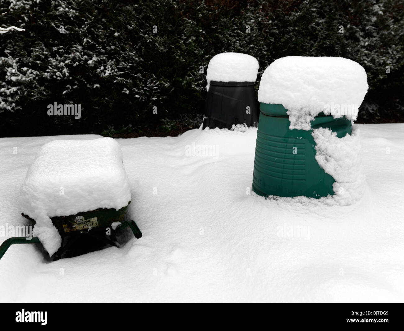 Two Compost Bins And A Wheelbarrow In The Snow In Garden Surrey England ...