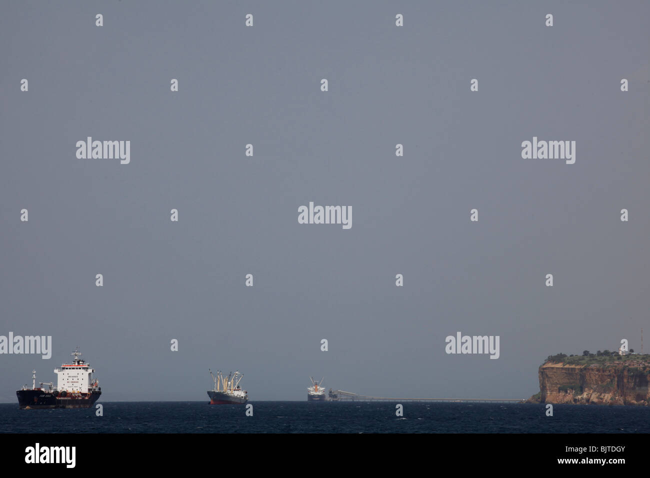 Container ships moored of the coast waiting to dock at Luanda Port ...