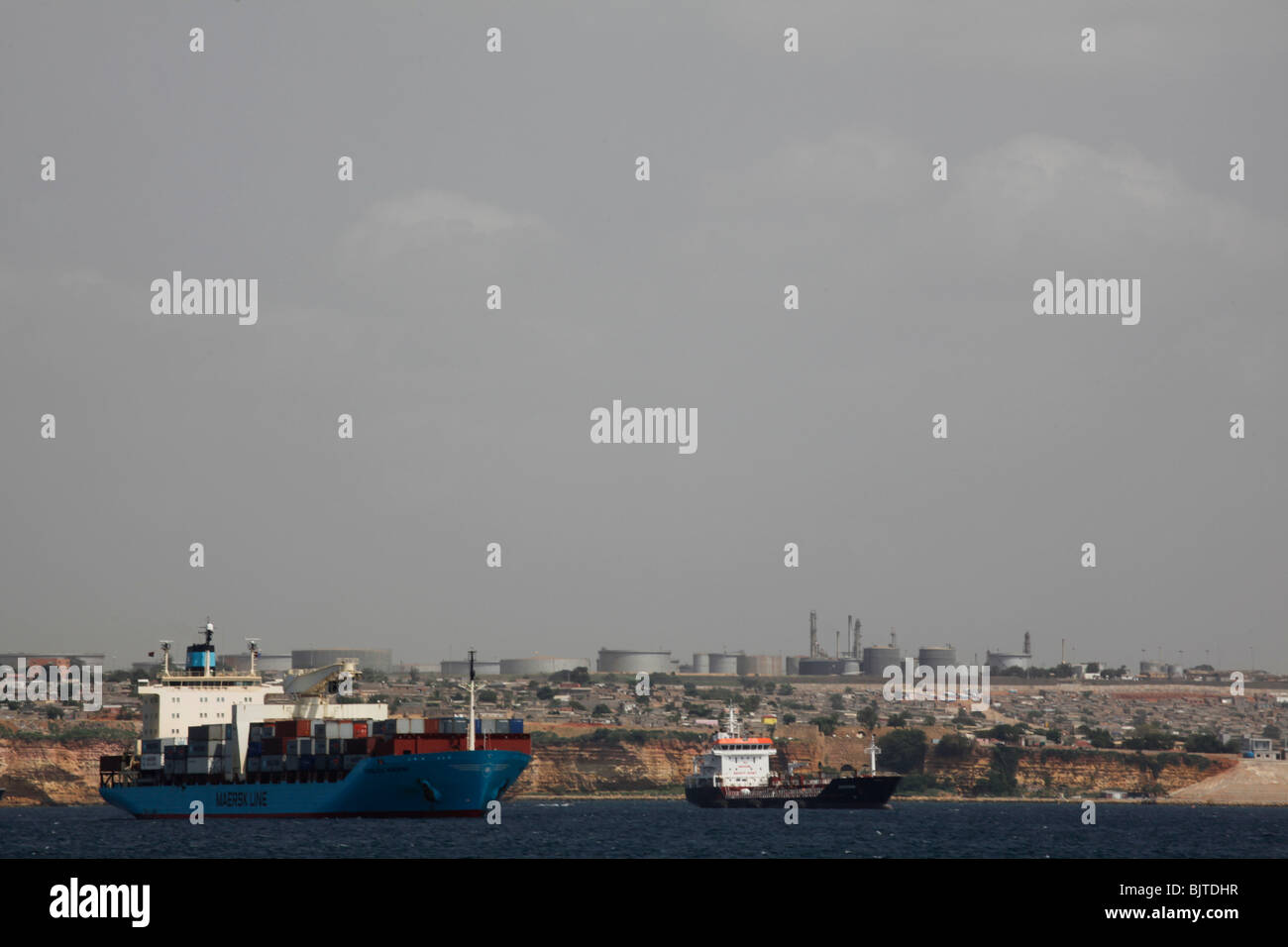 Container ships moored in the bay waiting to dock at Luanda Port. In ...