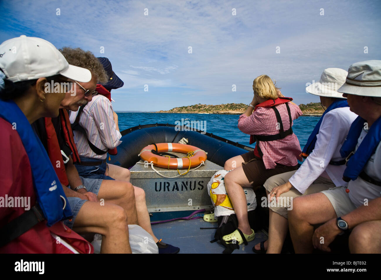 An Orion Zodiac approaches Jar Island in remote Vansittart Bay during a ...