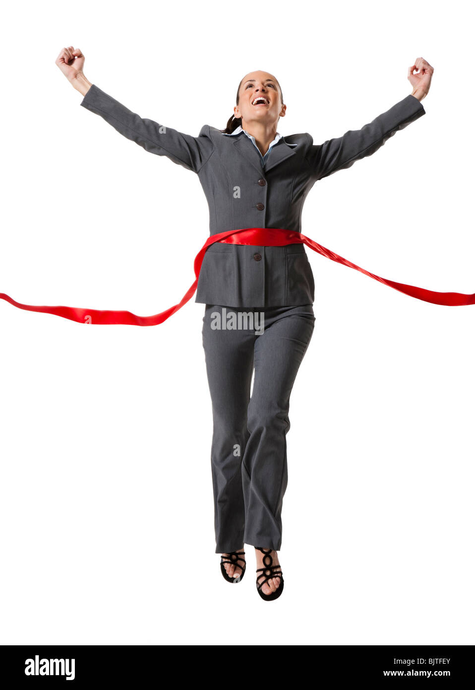 Businesswoman crossing finish line Stock Photo - Alamy