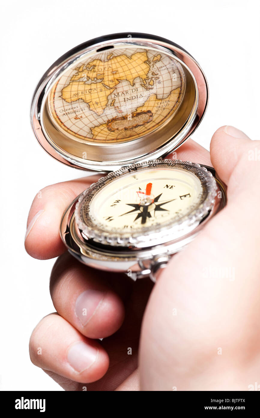 Hand holding compass Stock Photo - Alamy