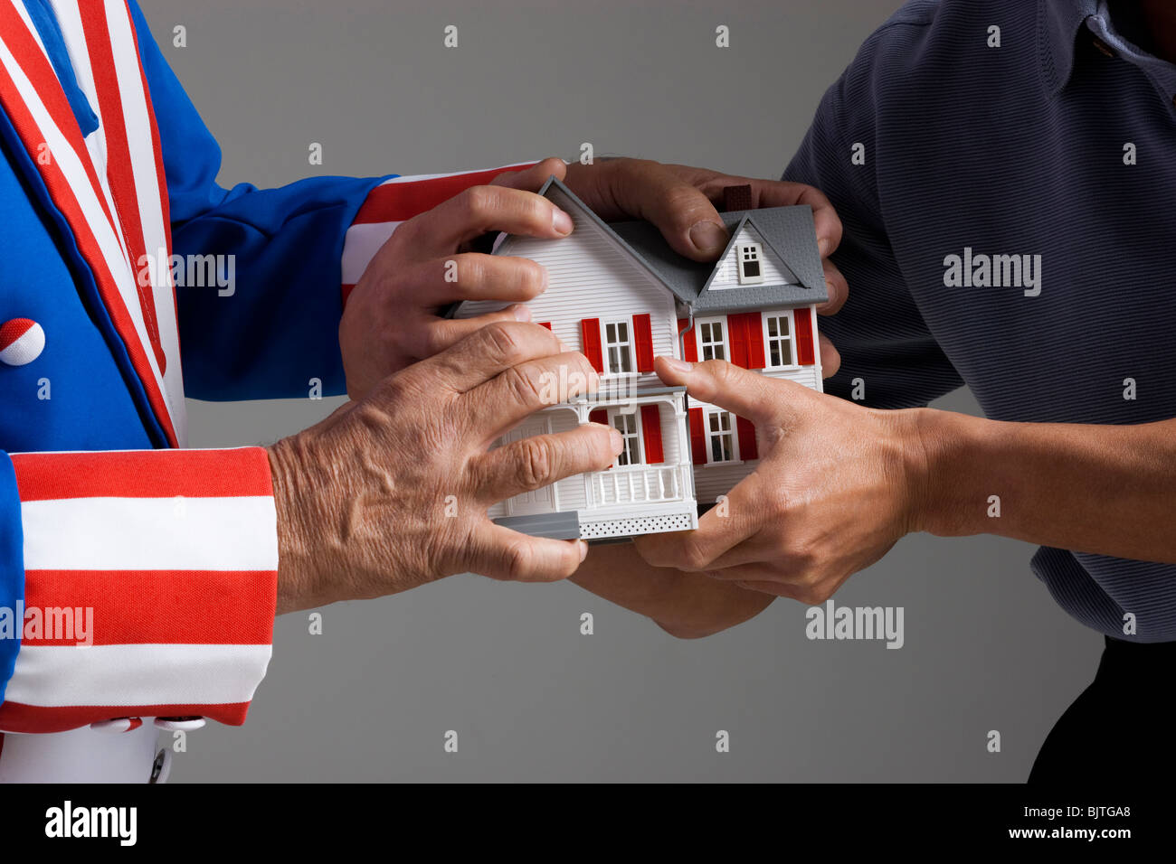 Two men pulling model house hi-res stock photography and images - Alamy