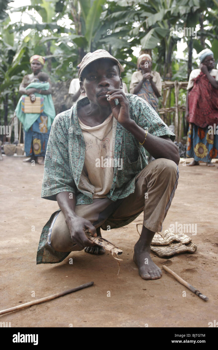 People from the Pygmy tribe perfroming dance for tourists as part of ...