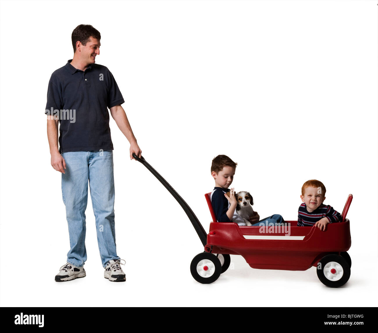 Father with sons and toy wagon Stock Photo - Alamy