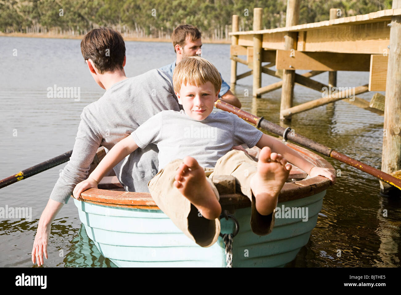 Family with rowing boat Stock Photo - Alamy