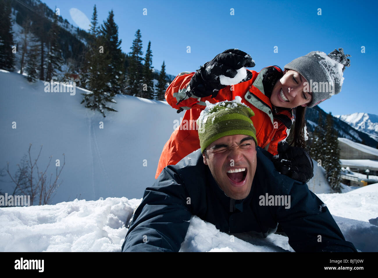 Couples playing in the snow hi-res stock photography and images - Alamy