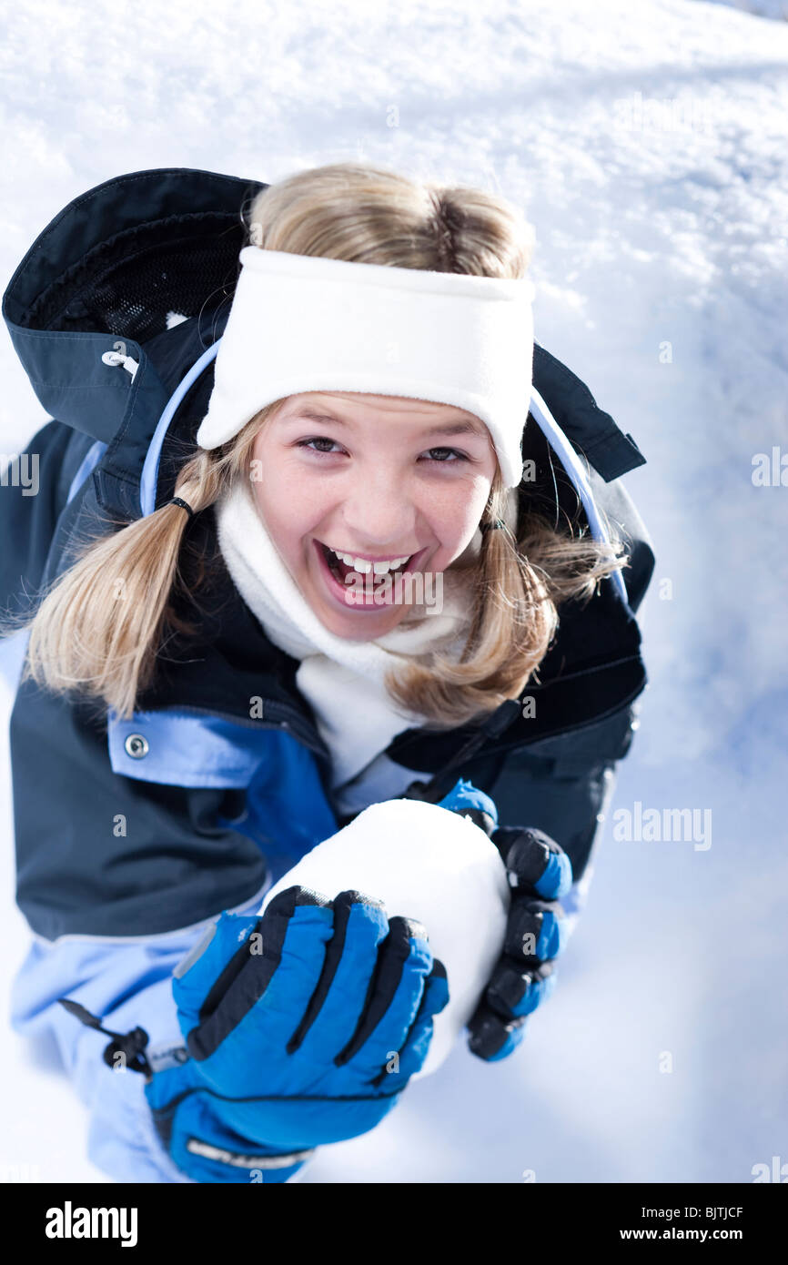 Girl with snowball Stock Photo - Alamy