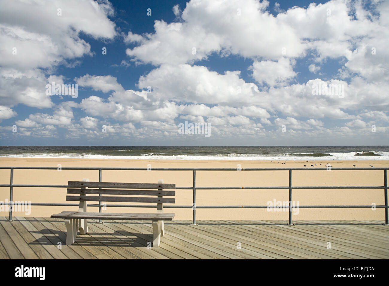 Bench on boardwalk Stock Photo - Alamy