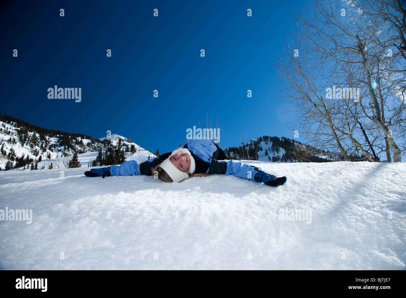 Girl sliding on back Stock Photo - Alamy
