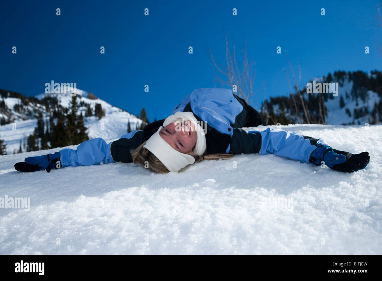 Girl sliding on back Stock Photo - Alamy