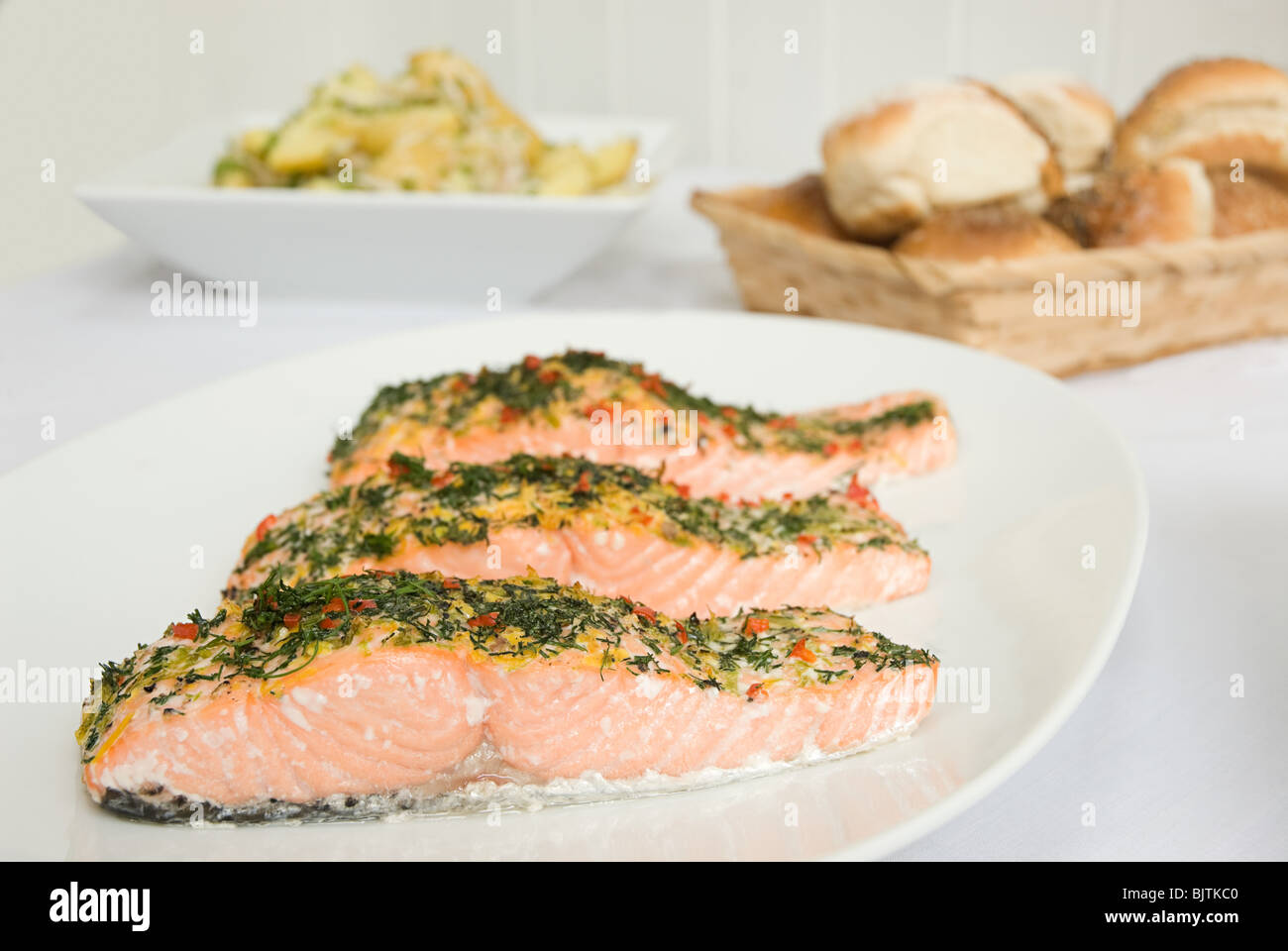 Poached salmon topped with dill Stock Photo - Alamy