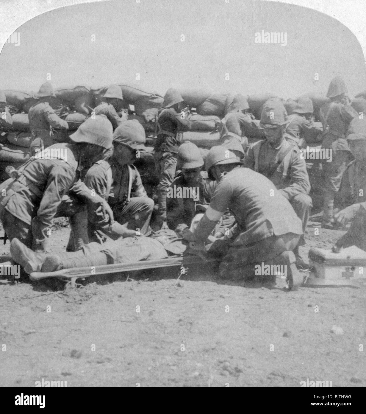 First aid to a wounded fusilier, Honey Nest Kloof Battle, Boer War ...