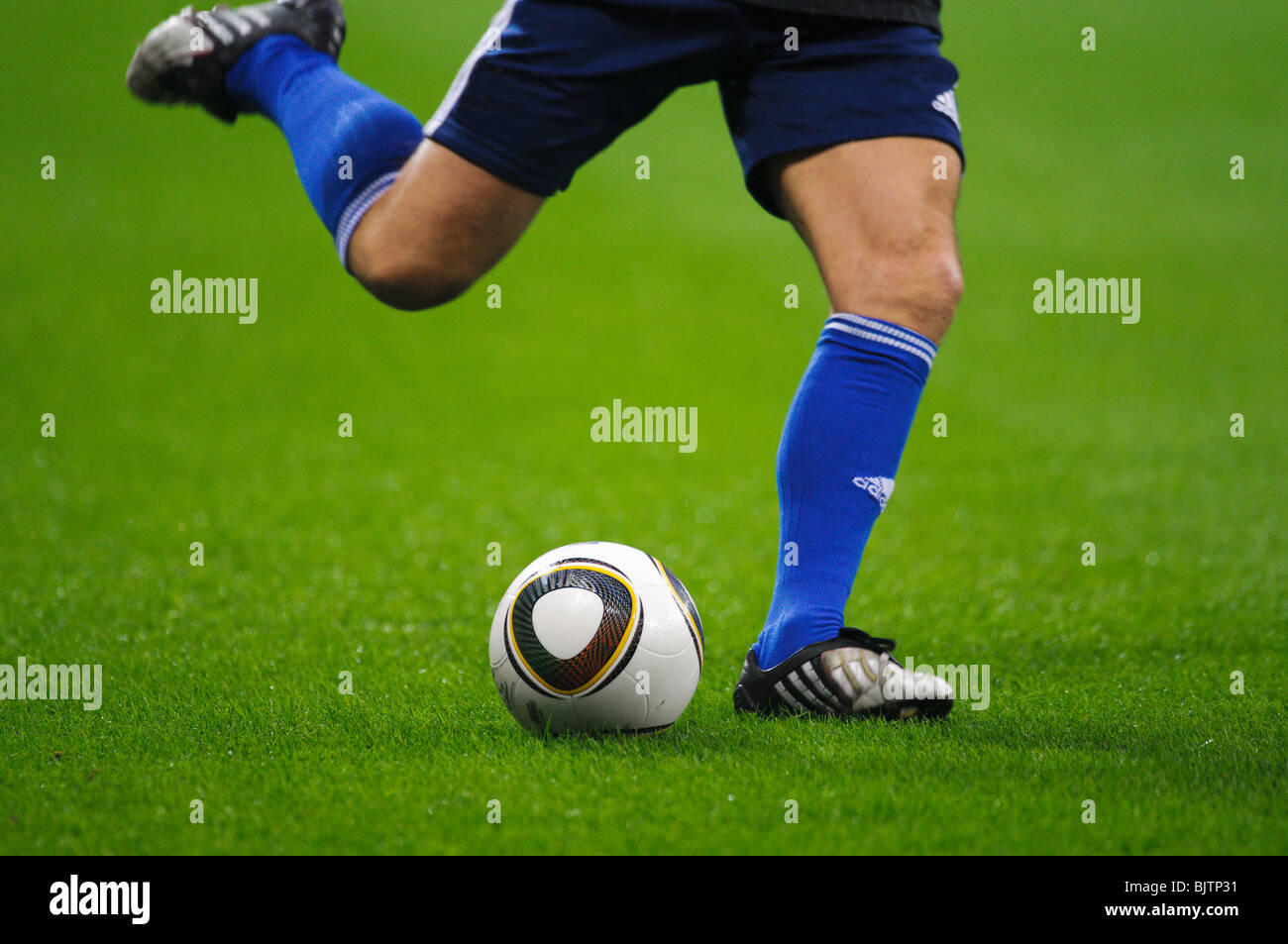 footballers legs and Jabulani, official matchball of the FIFA world Cup ...