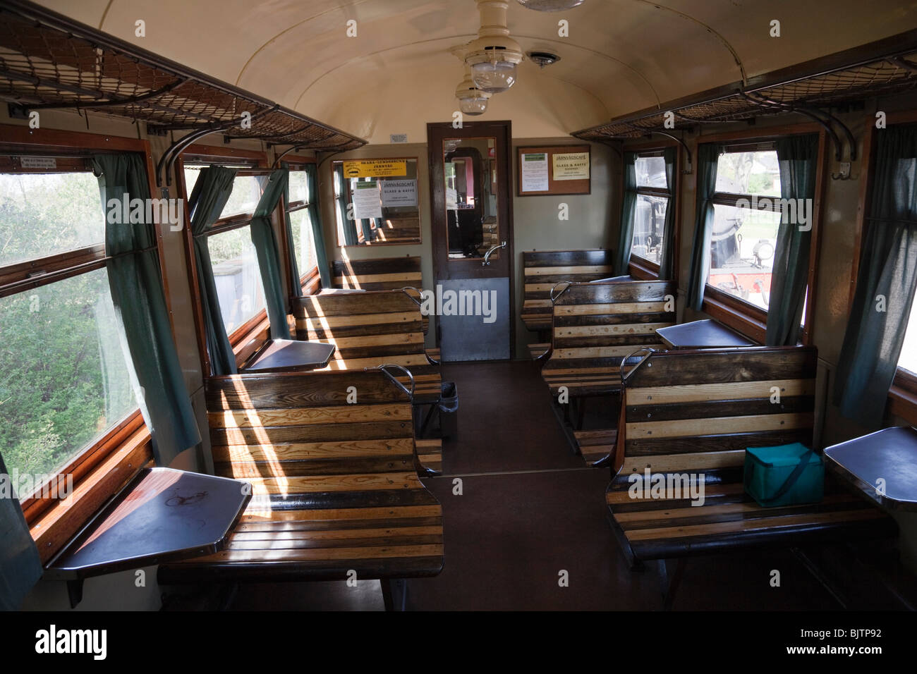 Interior of an old railway carriage with wooden benches Stock Photo - Alamy