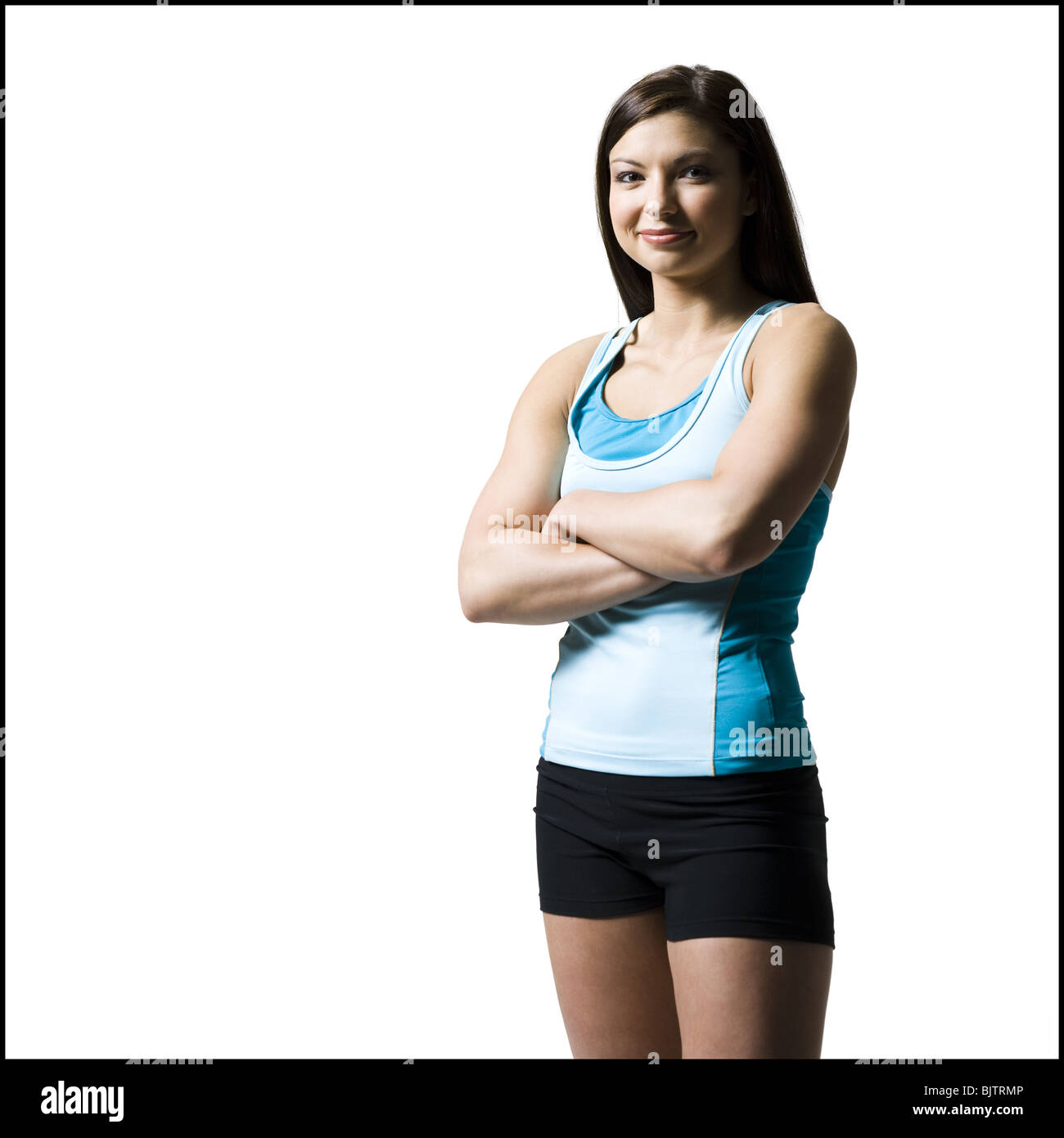 Woman standing with arms crossed Stock Photo - Alamy