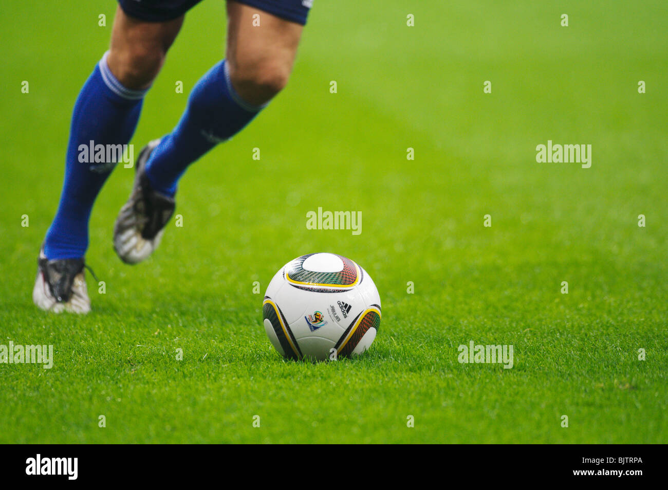footballers legs and Jabulani, official matchball of the FIFA world Cup ...