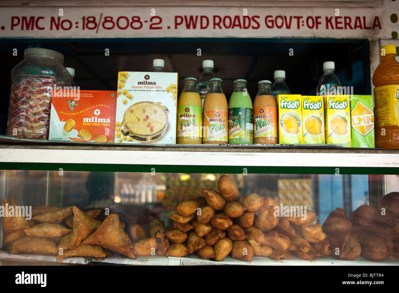 India, Kerala, Palakkad, samosas, cutlets and soft drinks on display at ...