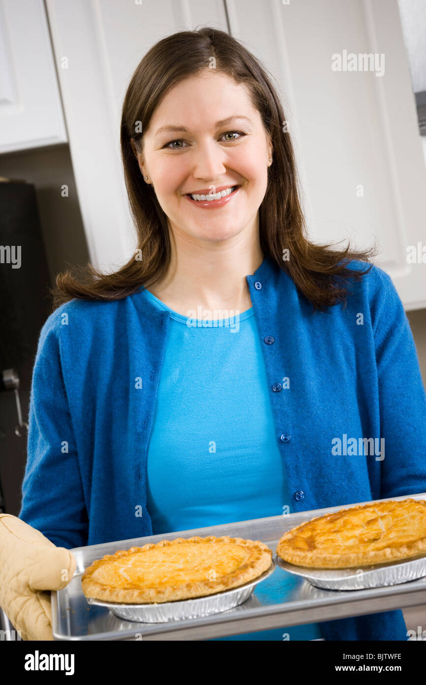 Woman with two pies Stock Photo - Alamy