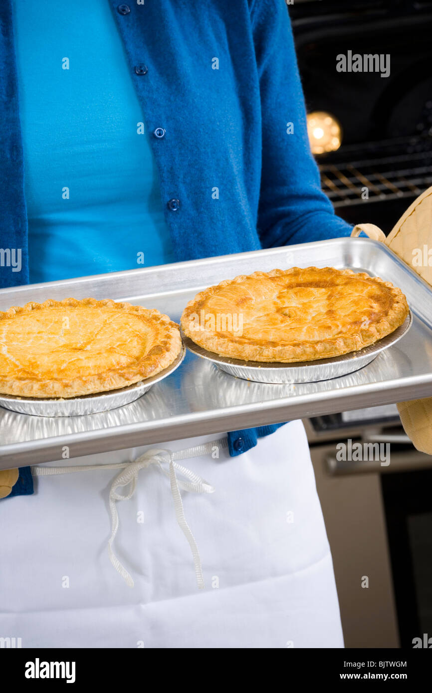 Woman with two pies Stock Photo - Alamy
