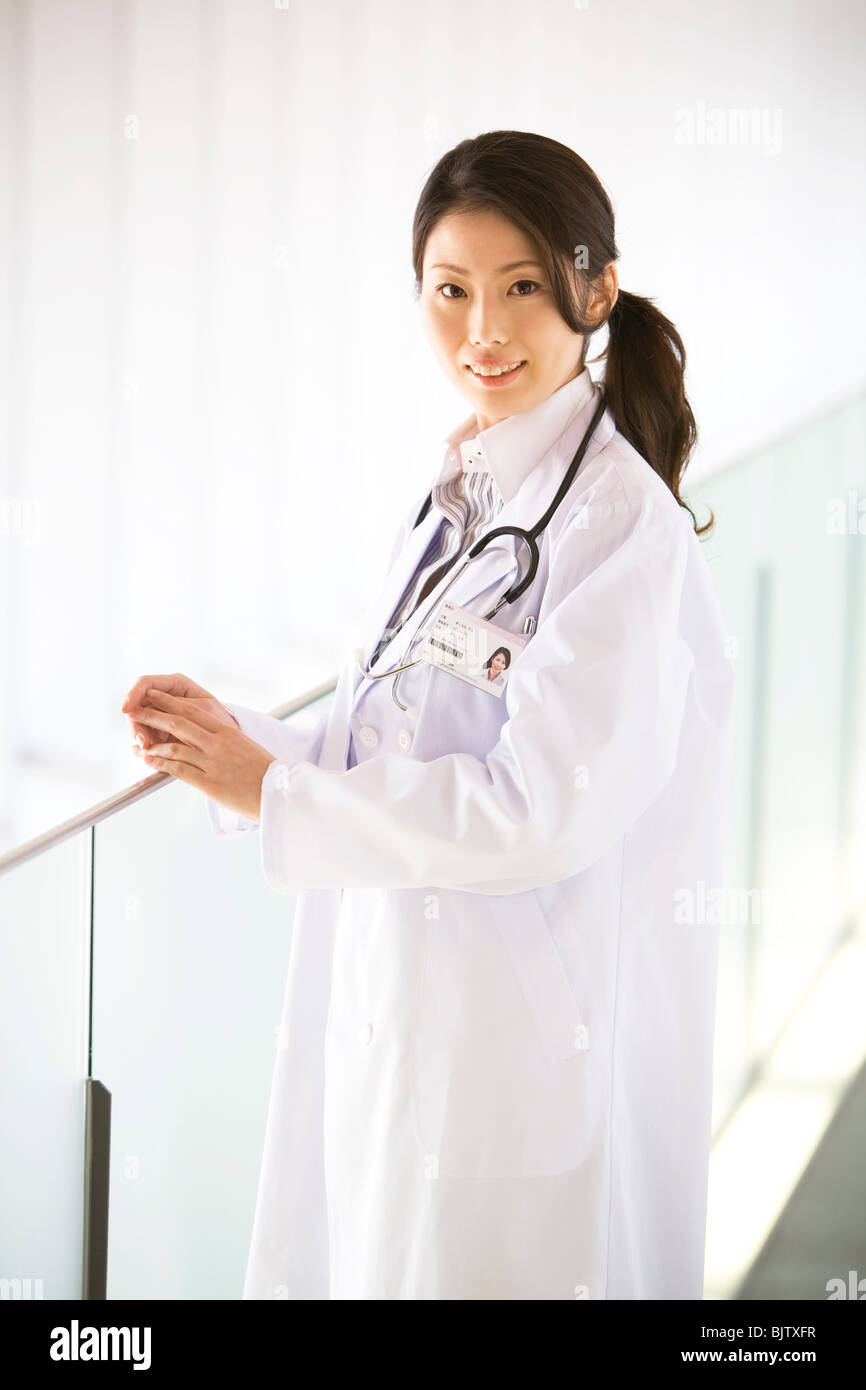 Doctor smiling at the camera Stock Photo - Alamy