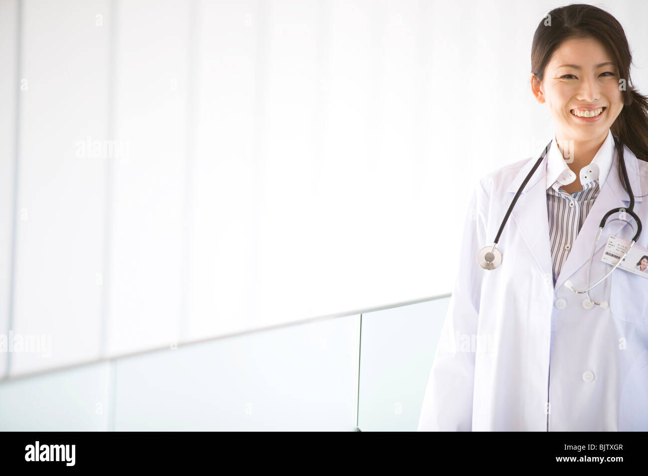 Doctor smiling at the camera Stock Photo - Alamy