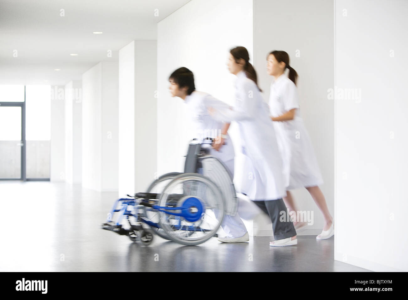 Wheelchair hospital running hi-res stock photography and images - Alamy