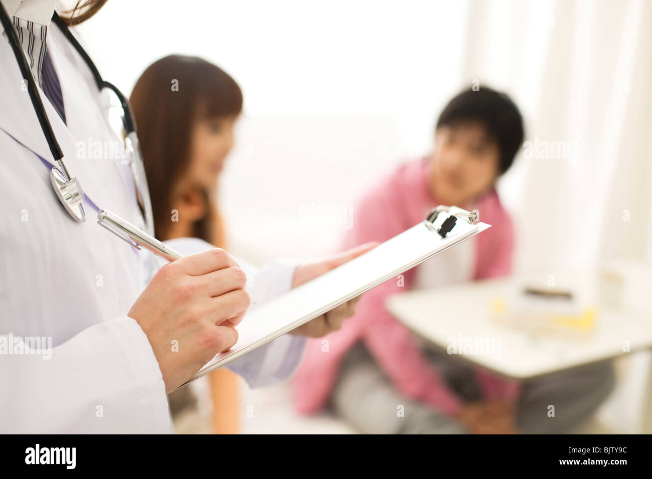 Doctor with a patient in a hospital room Stock Photo - Alamy