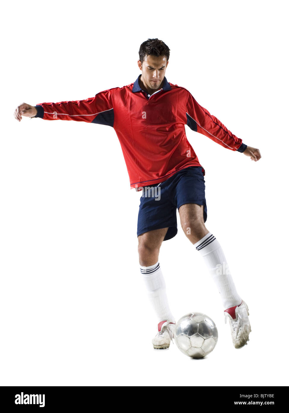 Soccer player kicking ball hi-res stock photography and images - Alamy