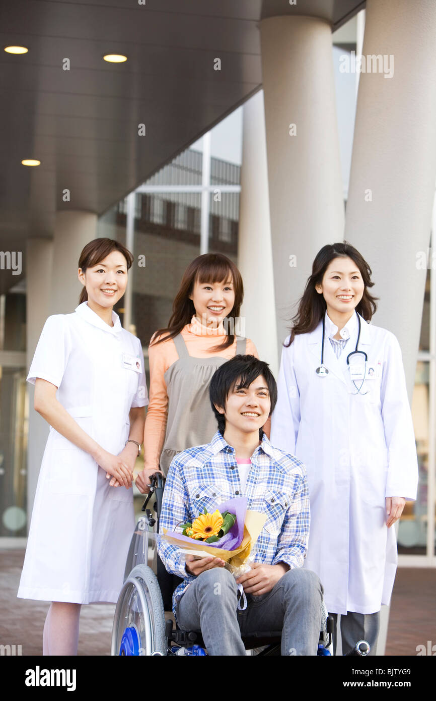 Patient with his doctor and nurse outside a hospital Stock Photo - Alamy