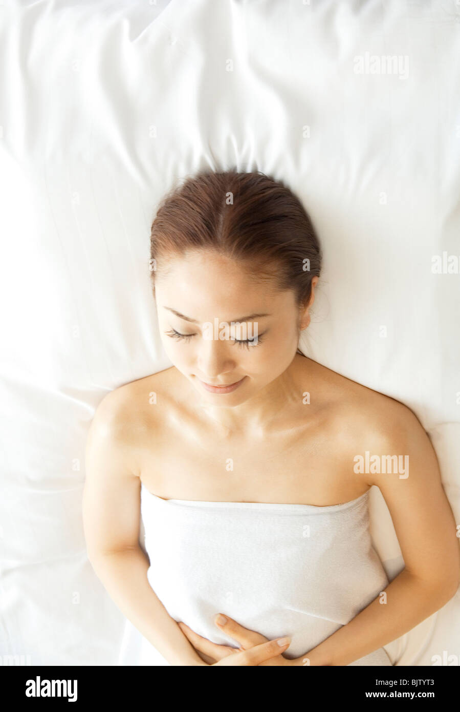 Woman relaxes after her massage Stock Photo - Alamy