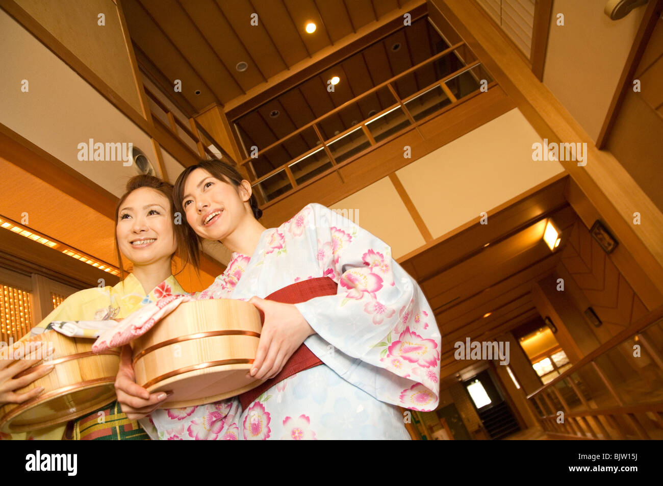Two women wearing yukata and holding spa products at a health spa Stock ...