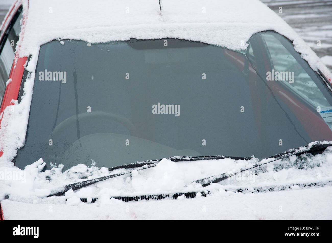 Clear car windscreen that has had all the snow and ice scraped off of ...