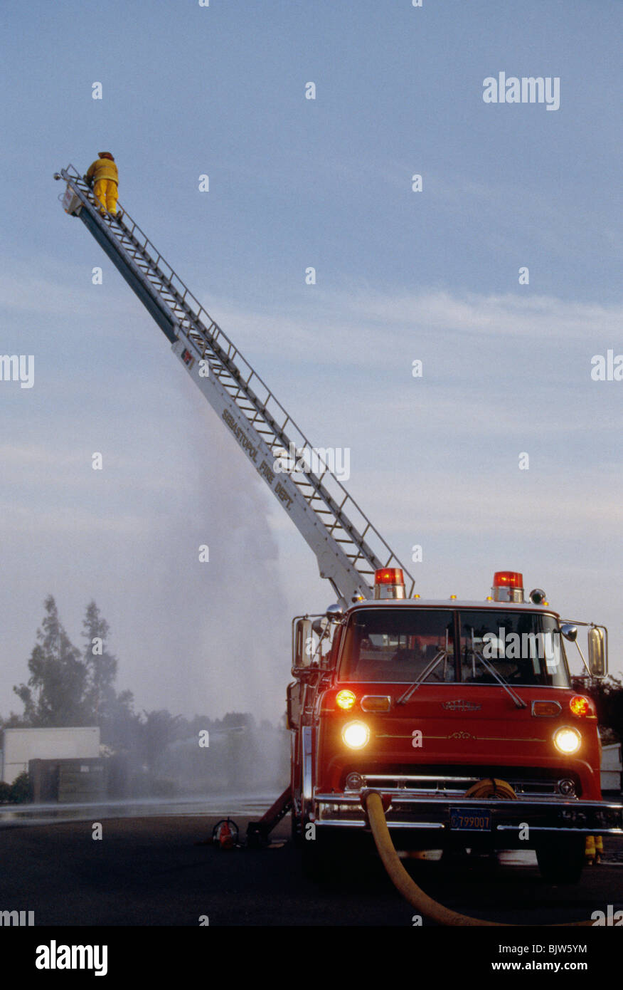 Firefighters climb ladder hi-res stock photography and images - Alamy