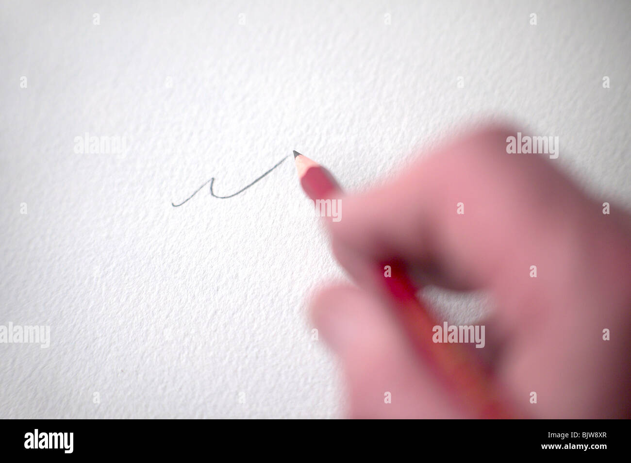 HAND WITH RED PENCIL DRAWING A LINE Stock Photo - Alamy