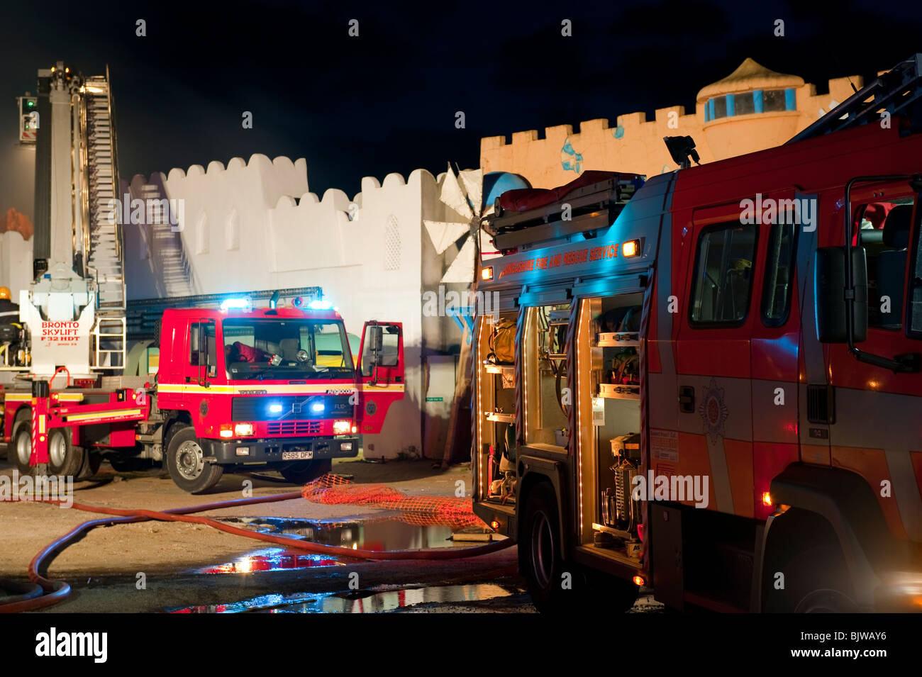 Fire Engines at fairground fire at night Stock Photo - Alamy
