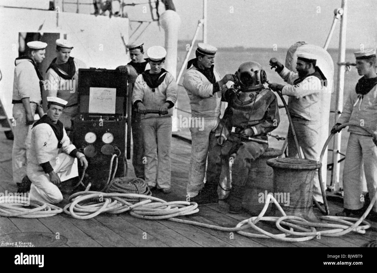 Diver and his apparatus on board HMS 'Blake', 1896. Artist: Gregory ...