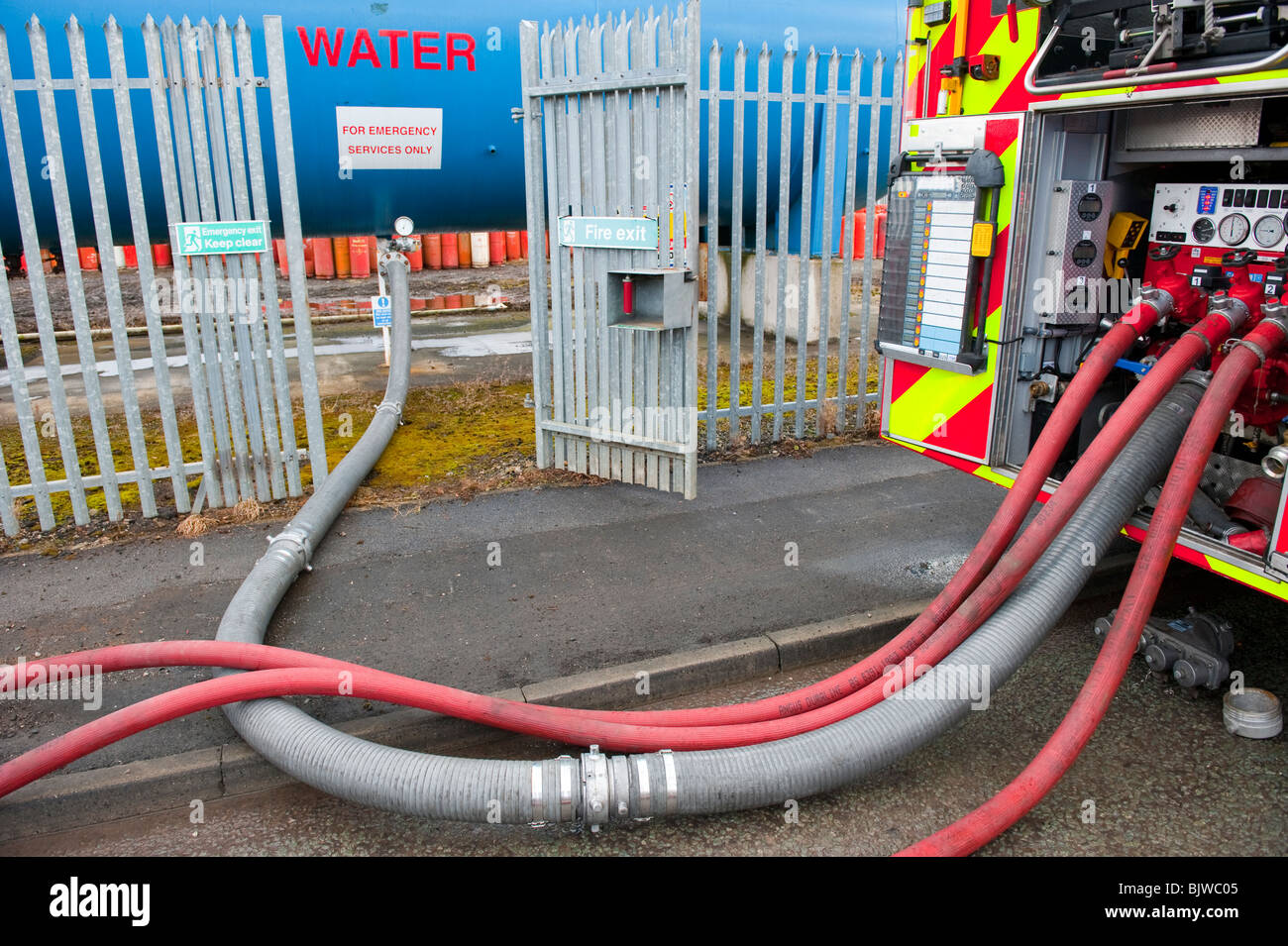 Fire engine with feed from bulk water storage tank Stock Photo - Alamy
