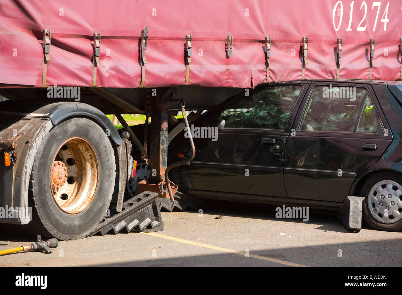 Car crashed under trailer of HGV Lorry Stock Photo - Alamy
