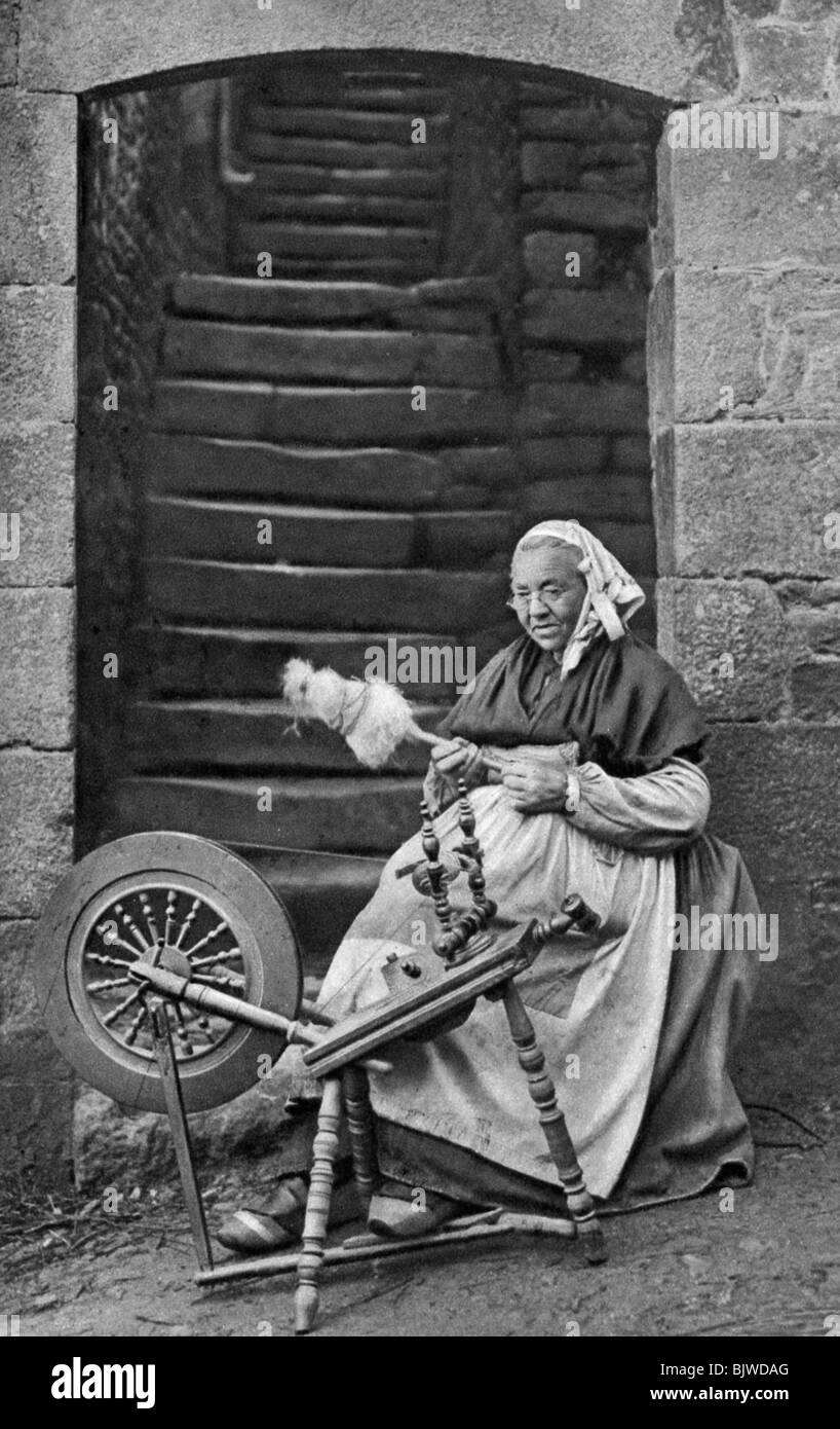 Woman sitting at spinning wheel hi-res stock photography and images - Alamy
