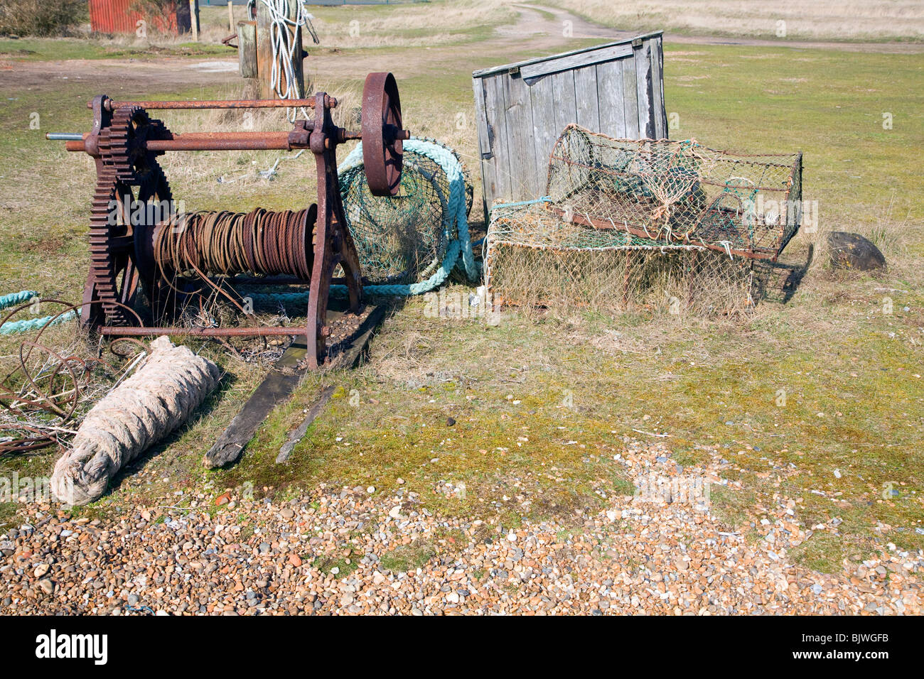 Old rusty fishing winch and lobster pots Shingle Street Suffolk Stock ...