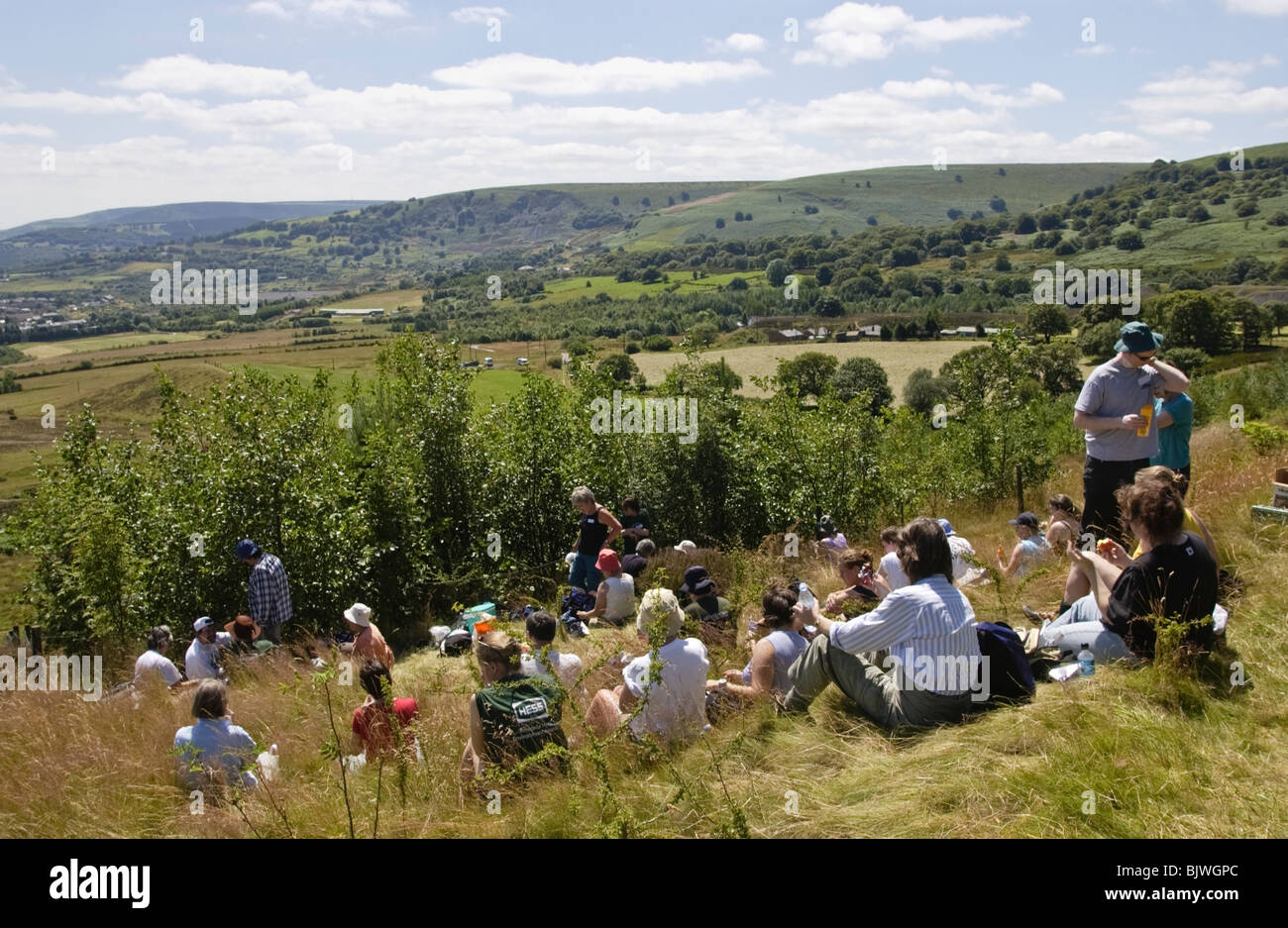 Volunteers take a break on the reclaimed coal tips at the Varteg Field ...