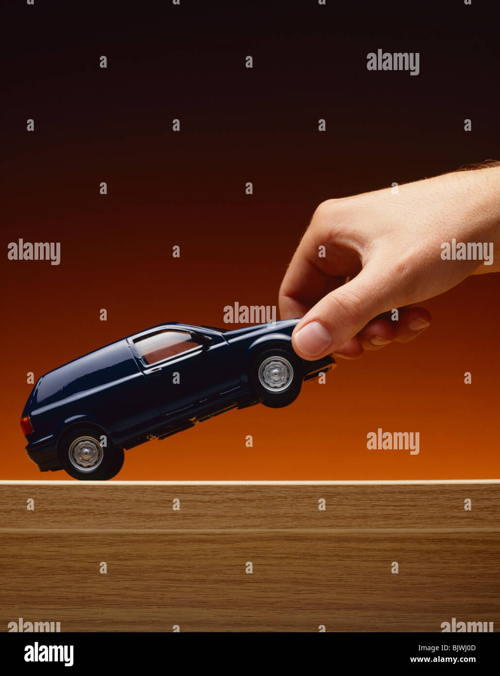 Hand Picking Up Model Van Stock Photo - Alamy