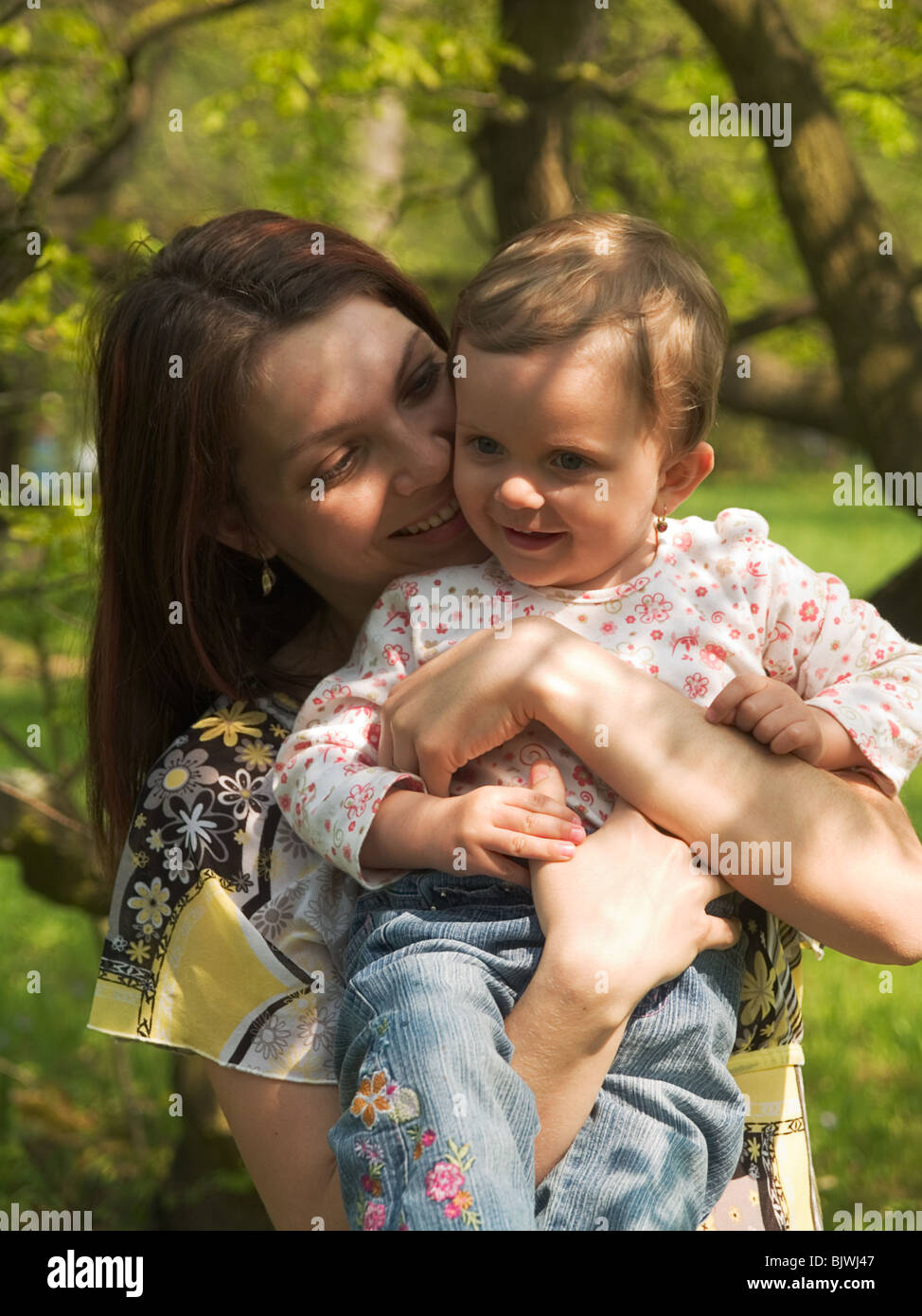Mother with baby indoor Stock Photo - Alamy