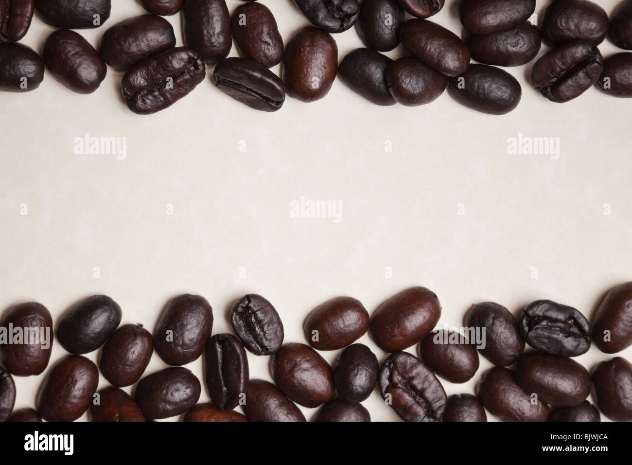 coffee beans on a parchment paper background Stock Photo - Alamy