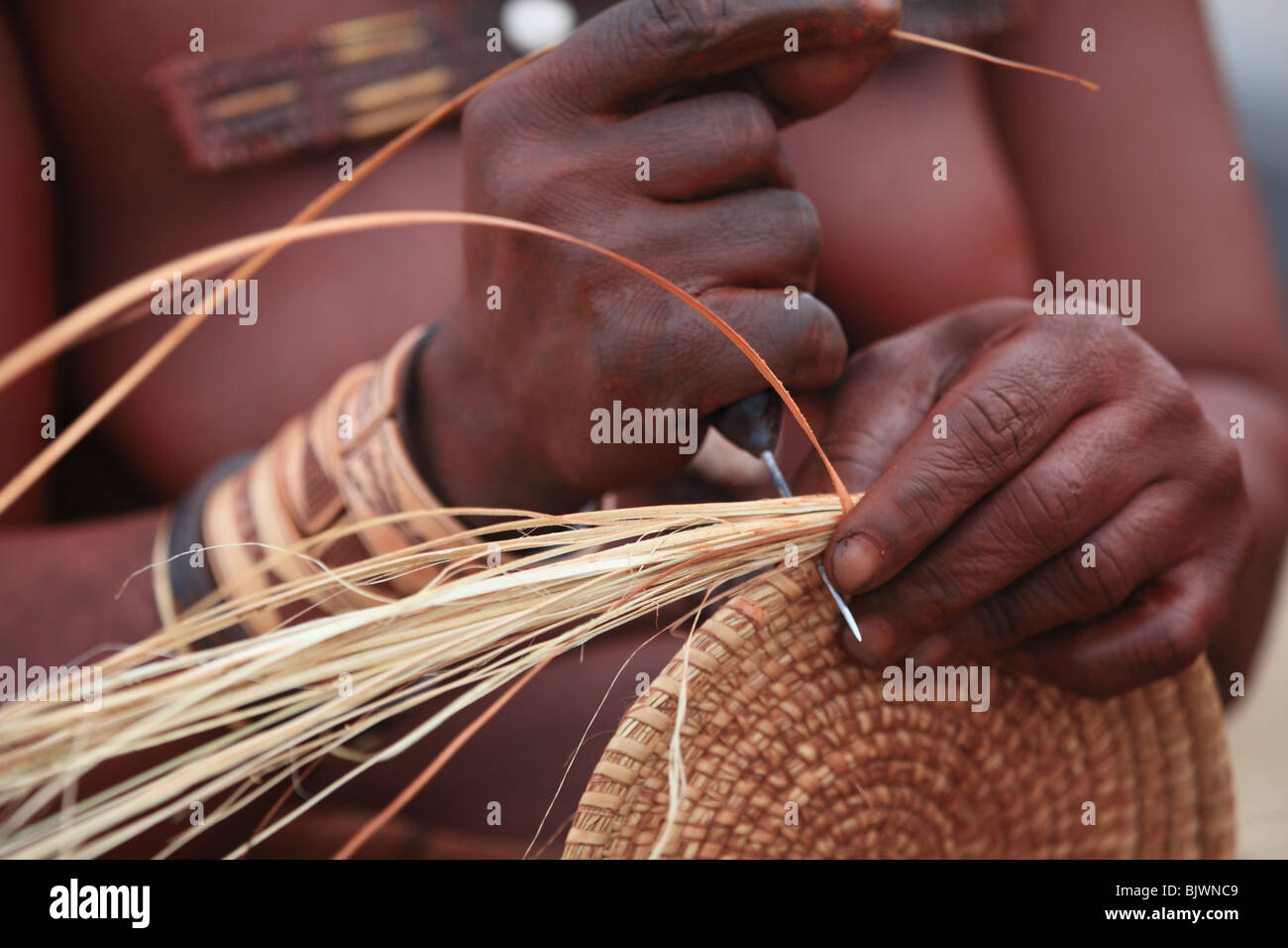 Himba Woman Weaving Basket Stock Photo - Alamy