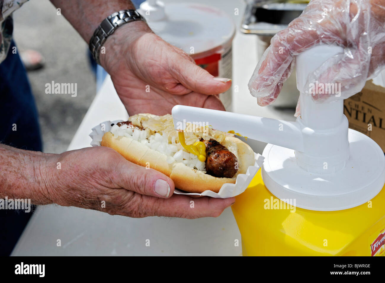 preparing hot dog for eating Stock Photo - Alamy